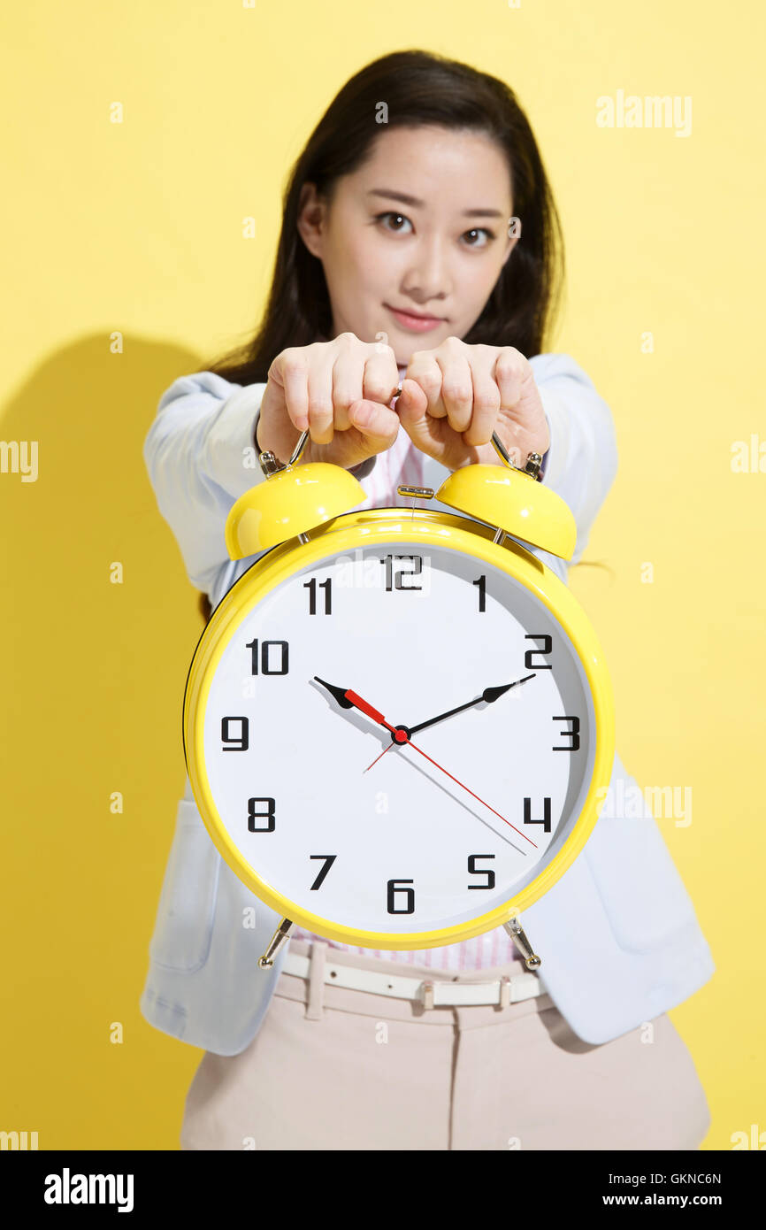 China clock person hi-res stock photography and images - Alamy
