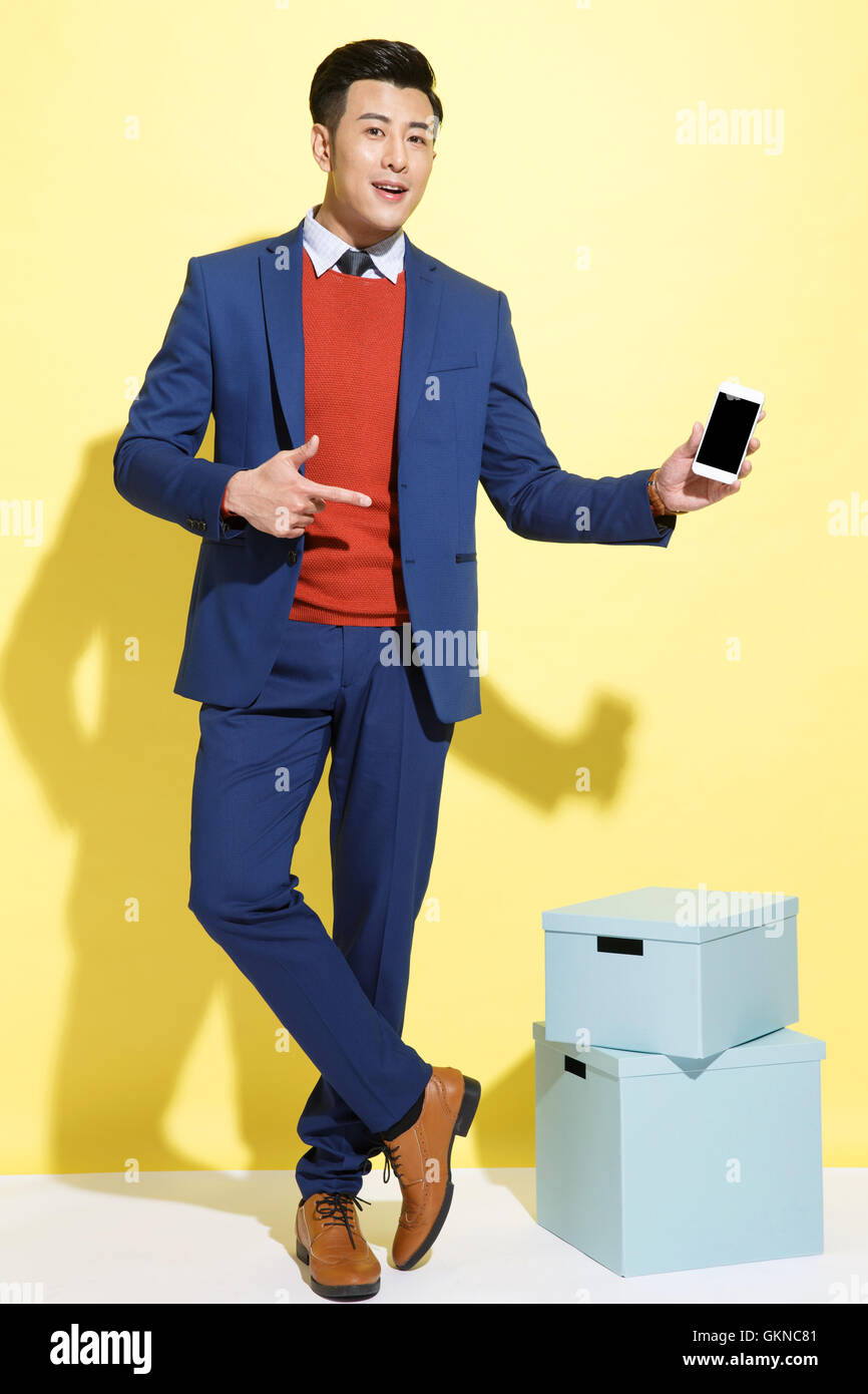 Young business man display mobile phone Stock Photo - Alamy