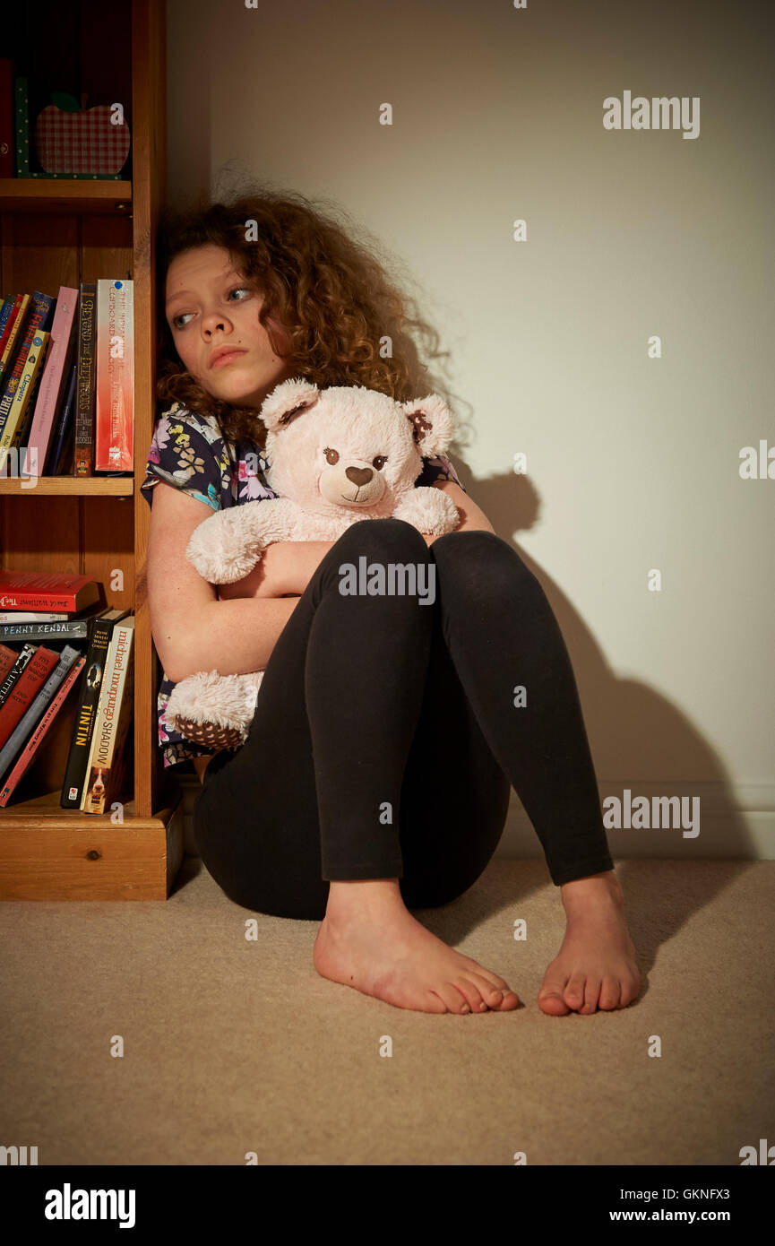 Child curled up bed hi-res stock photography and images - Alamy