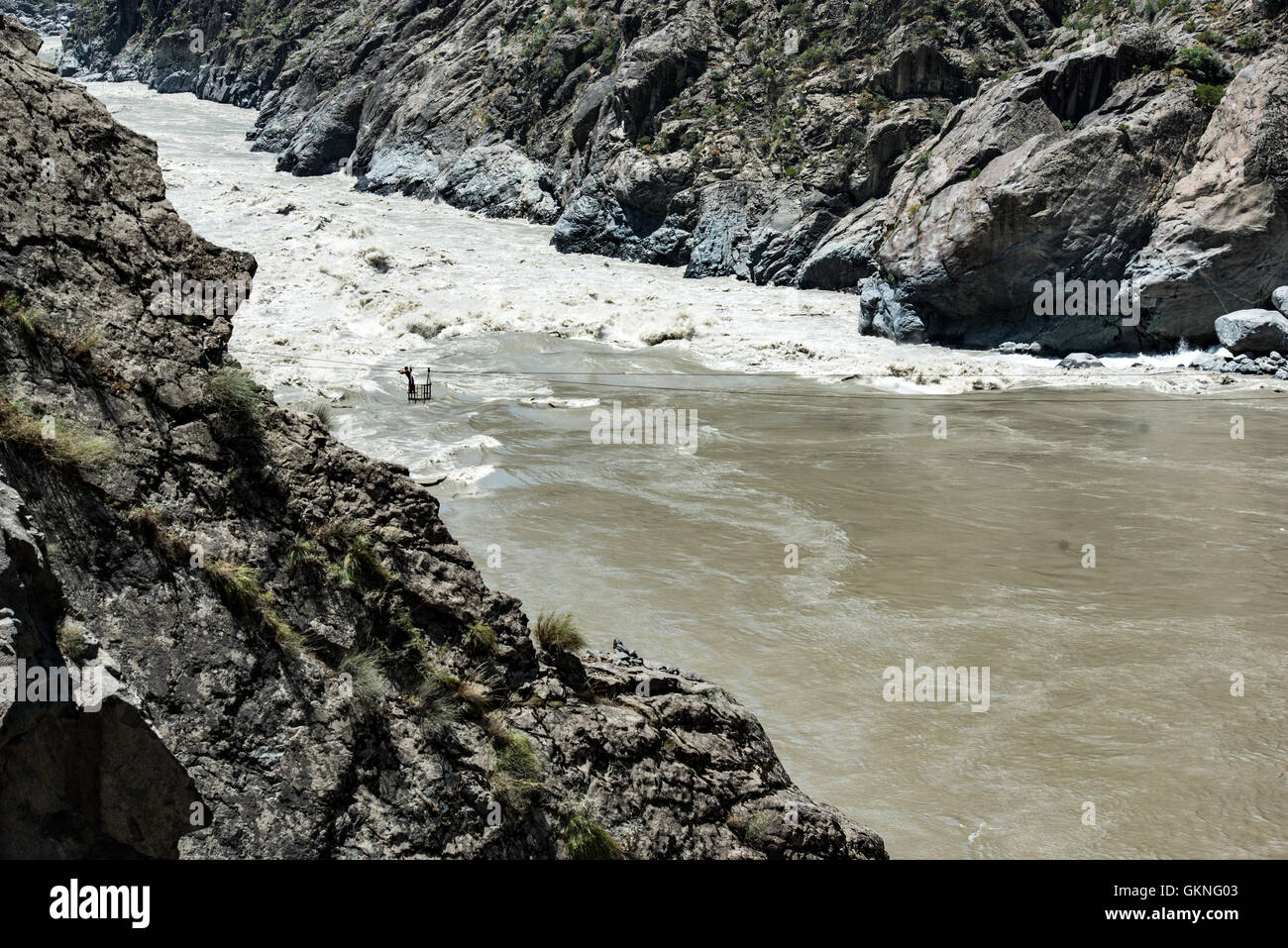 Cage and cable bridge across Indus river in Pakistan Stock Photo - Alamy