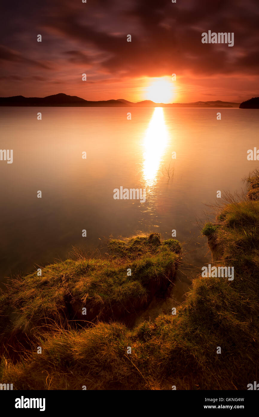 Sunset at the lake Stock Photo - Alamy