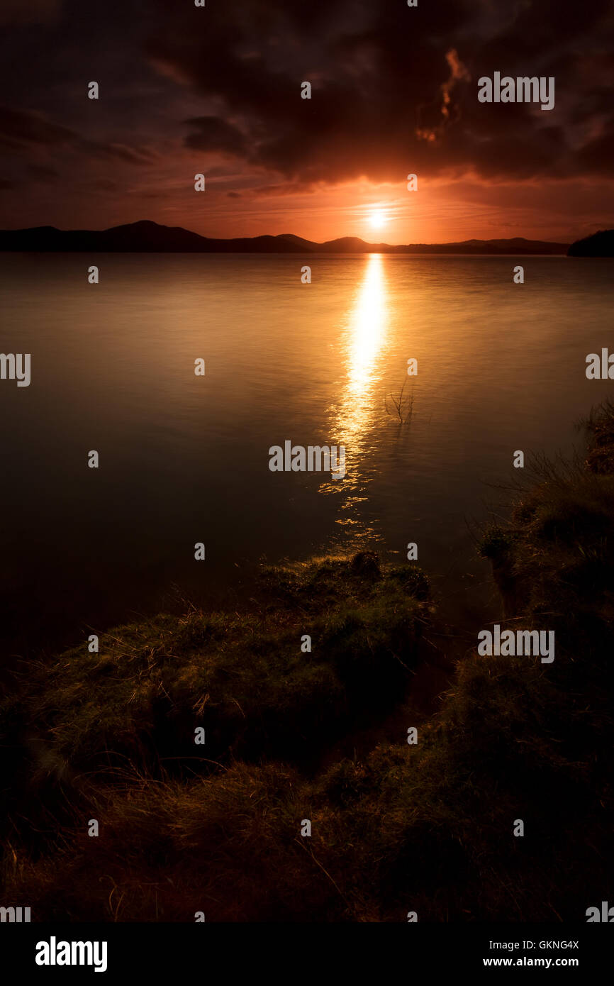 Sunset at the lake Stock Photo - Alamy