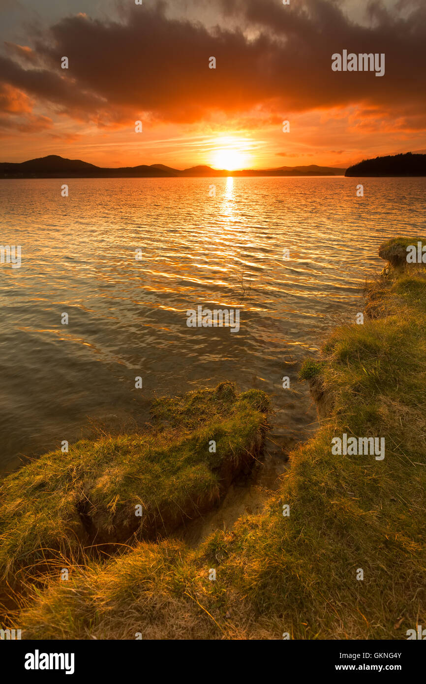 Sunset at the lake Stock Photo - Alamy