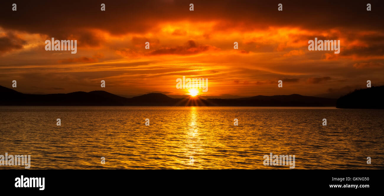 Sunset at the lake Stock Photo - Alamy
