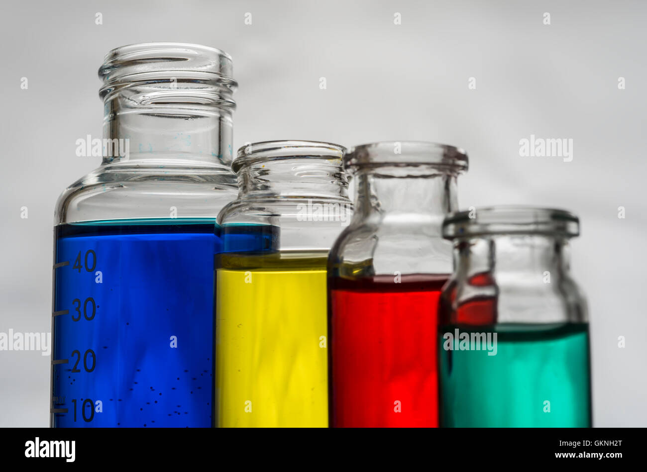 Set of laboratory bottles with color liquid Stock Photo - Alamy