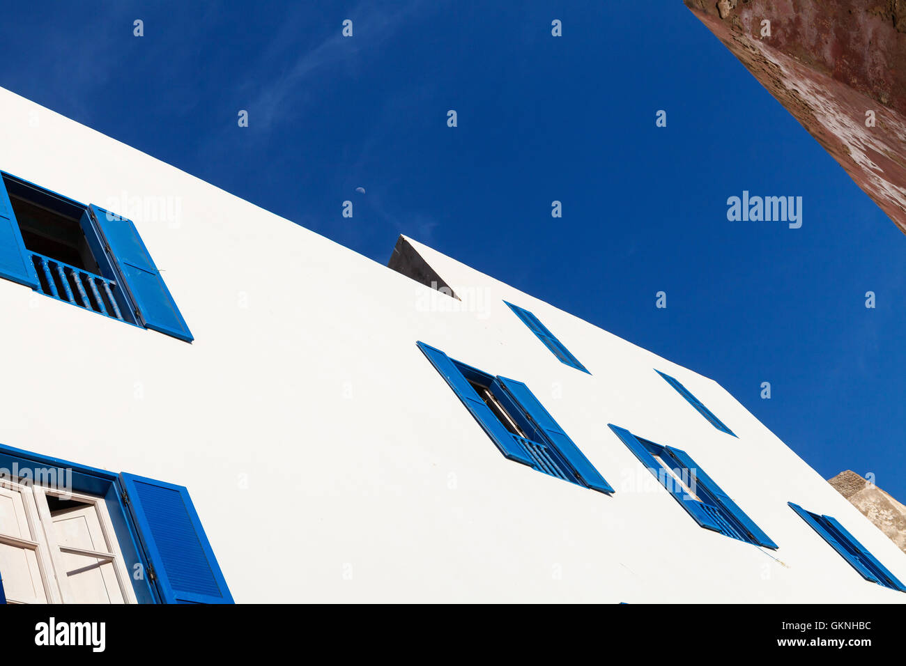 White building blue shutters hi-res stock photography and images - Alamy