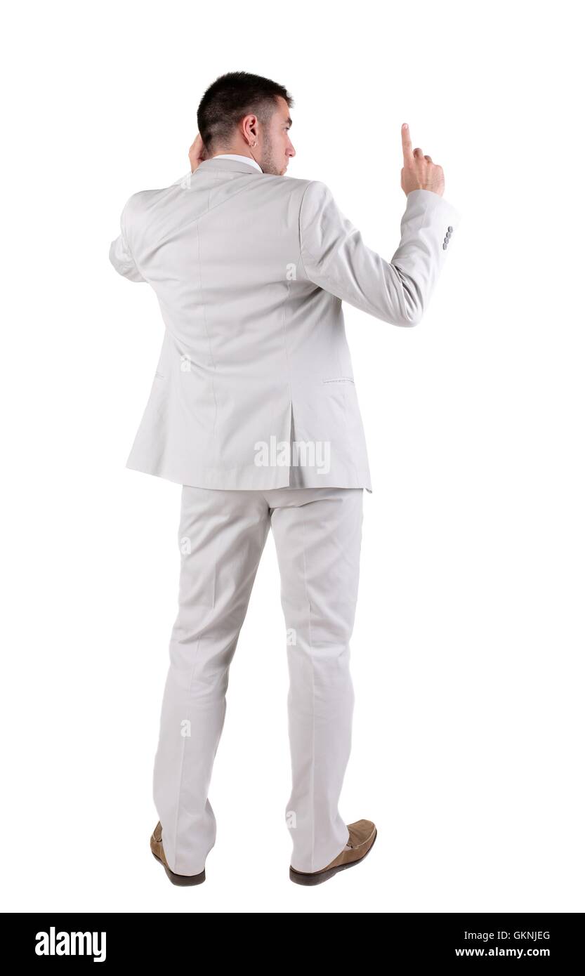 Back view of thinking young business man in white suit Stock Photo - Alamy