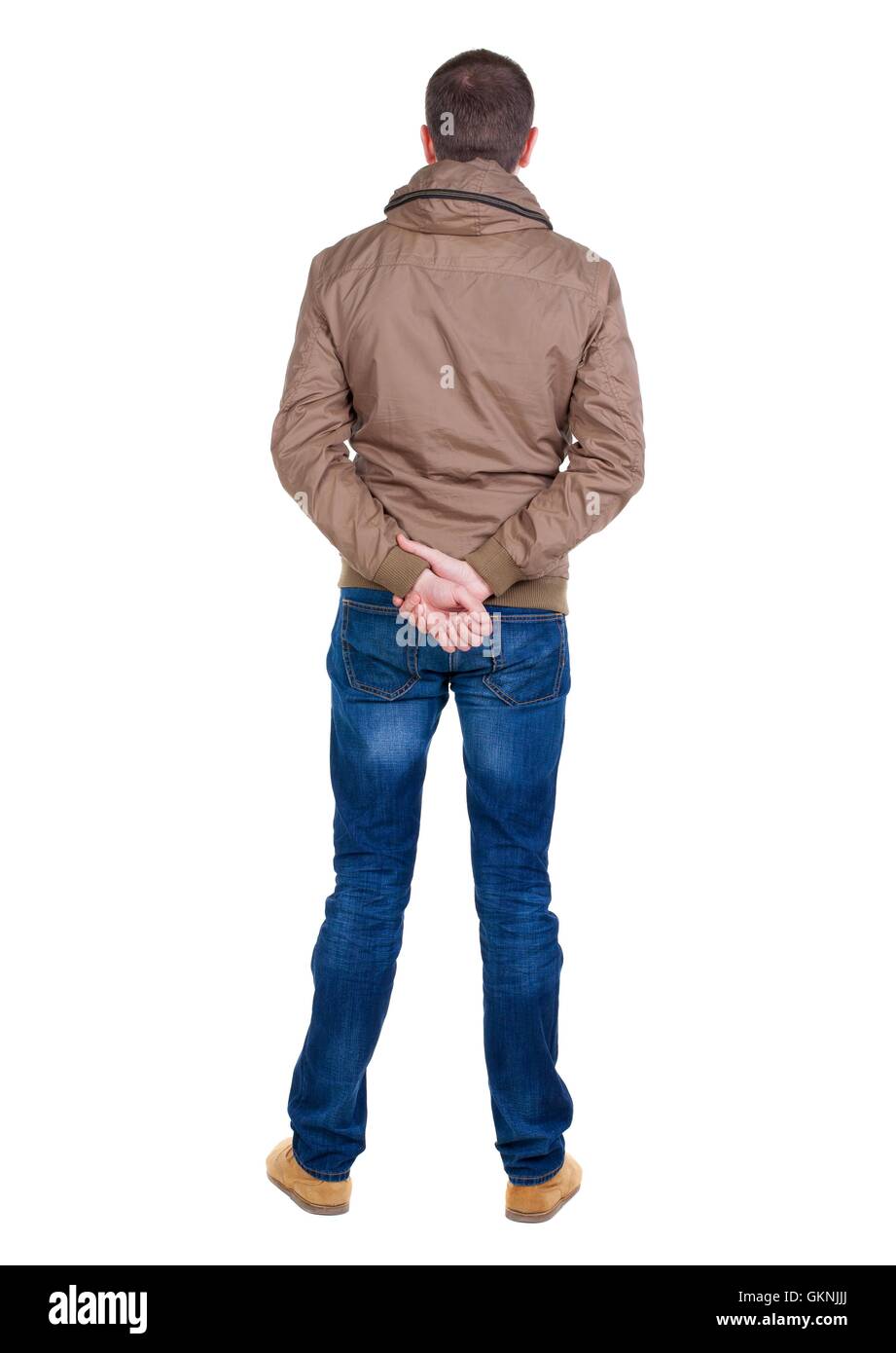 Back view of handsome man in brown windcheater looking up Stock Photo ...