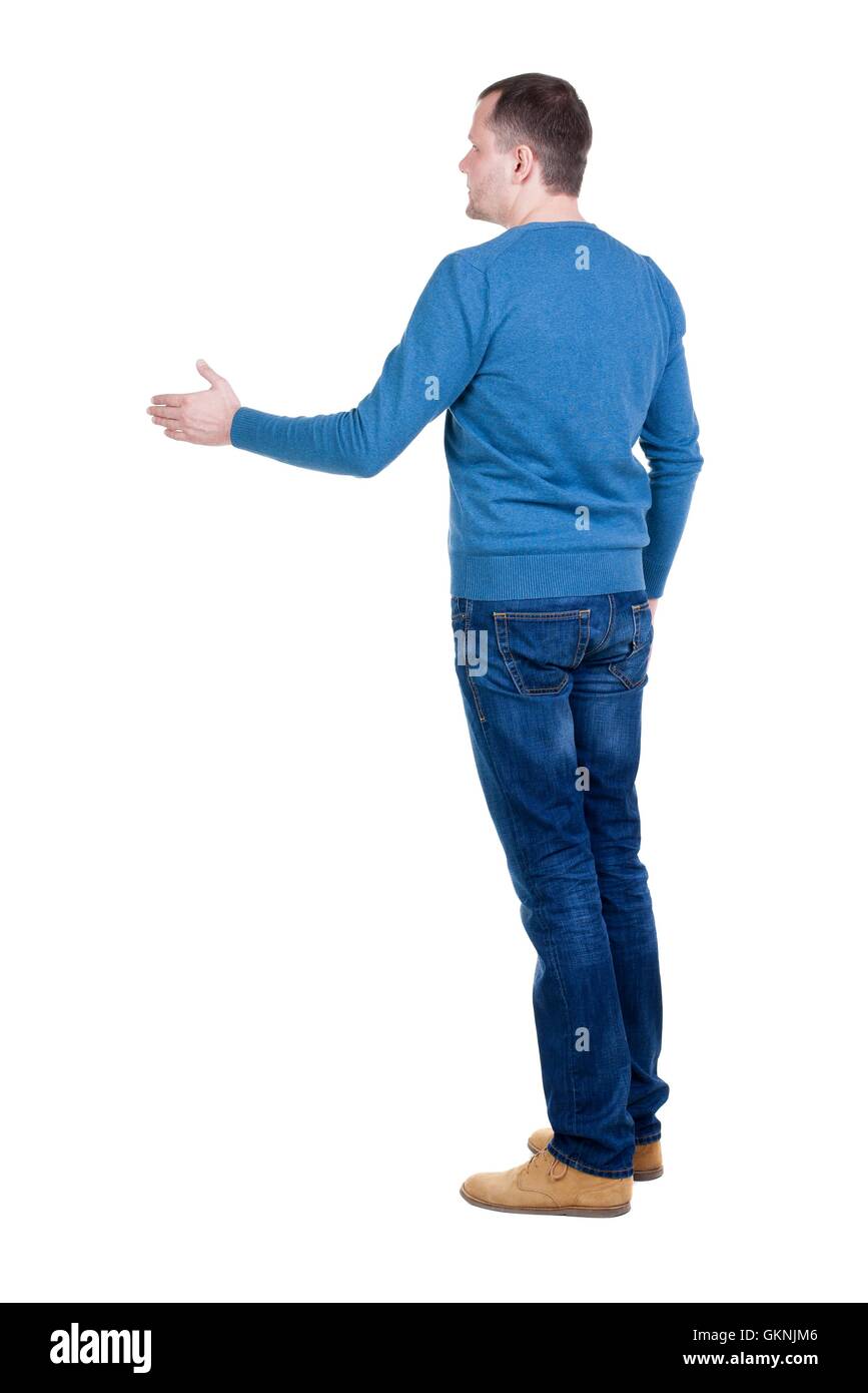 back view of man in movement reaches out to shake hands Stock Photo - Alamy