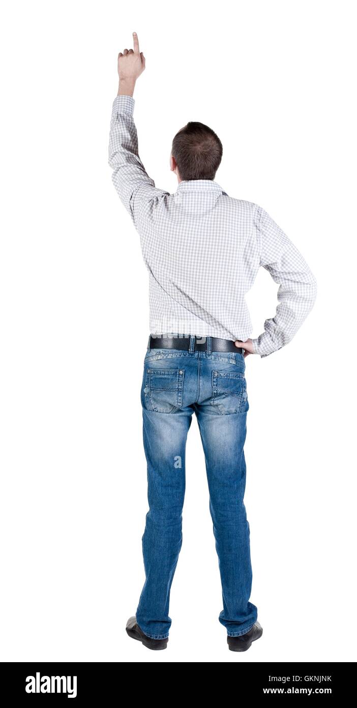 young man pointing at wall. rear view Stock Photo - Alamy