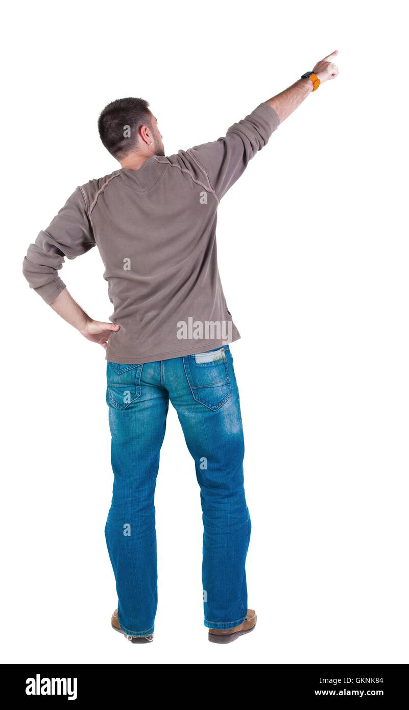 young man pointing at wall. rear view Stock Photo - Alamy