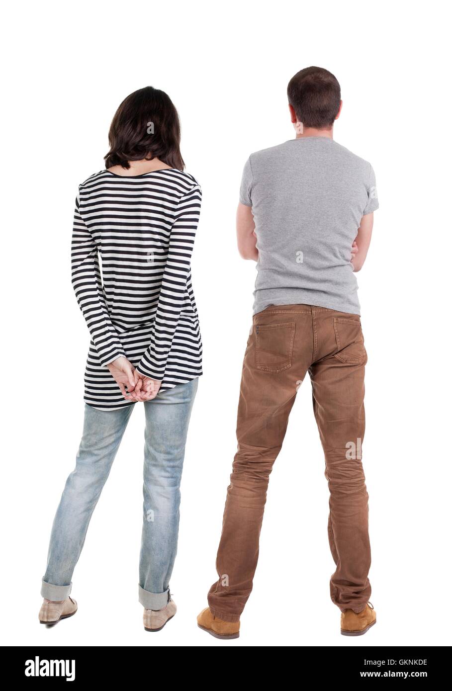 Back view of young couple hug and look into the distance Stock Photo ...