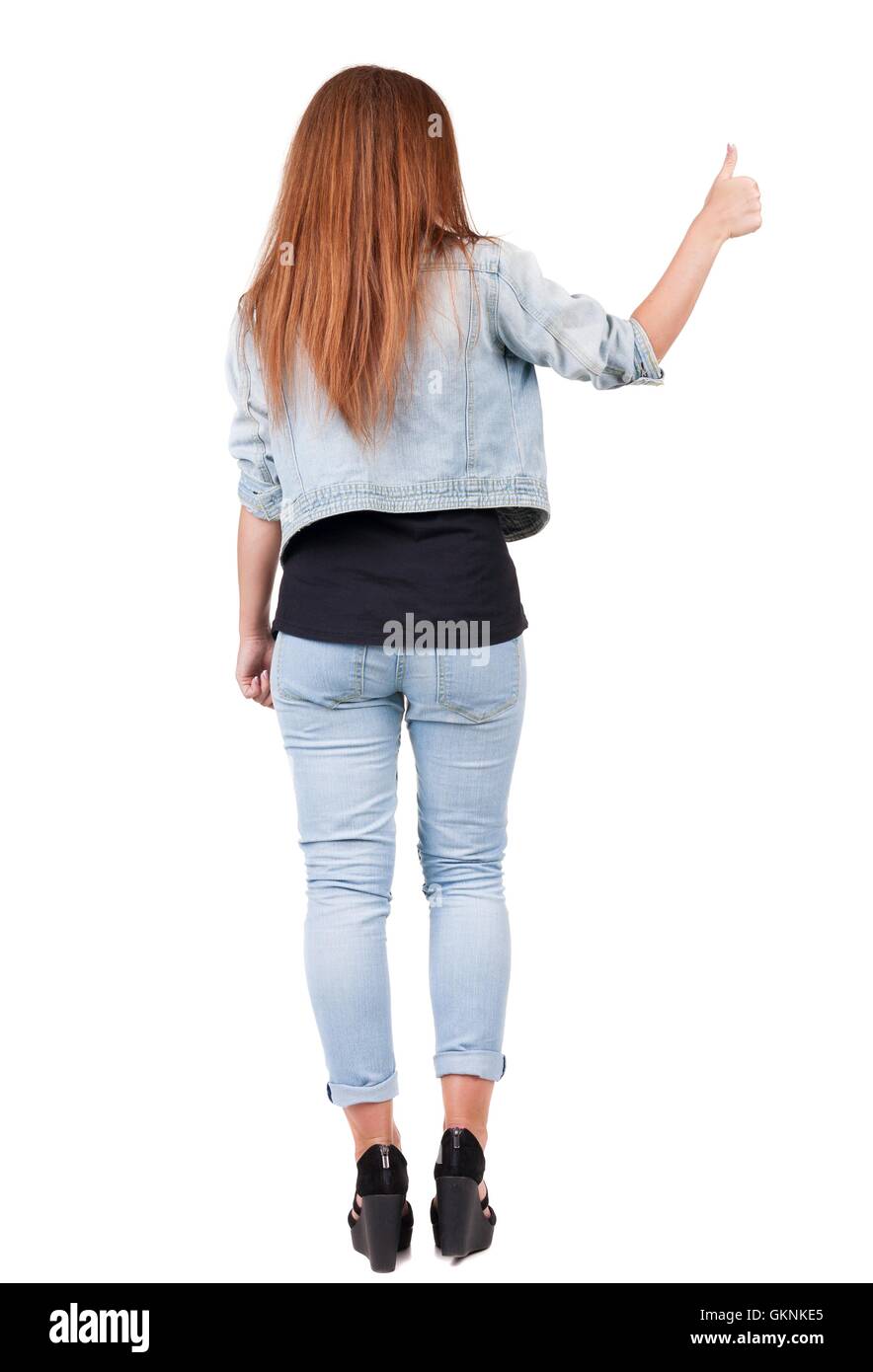 Back view of woman thumbs up Stock Photo - Alamy