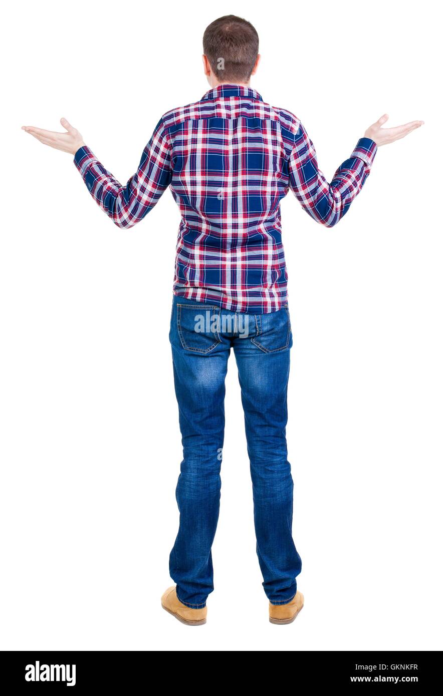 Back view of angry young man in jeans and checkered shirt Stock Photo ...