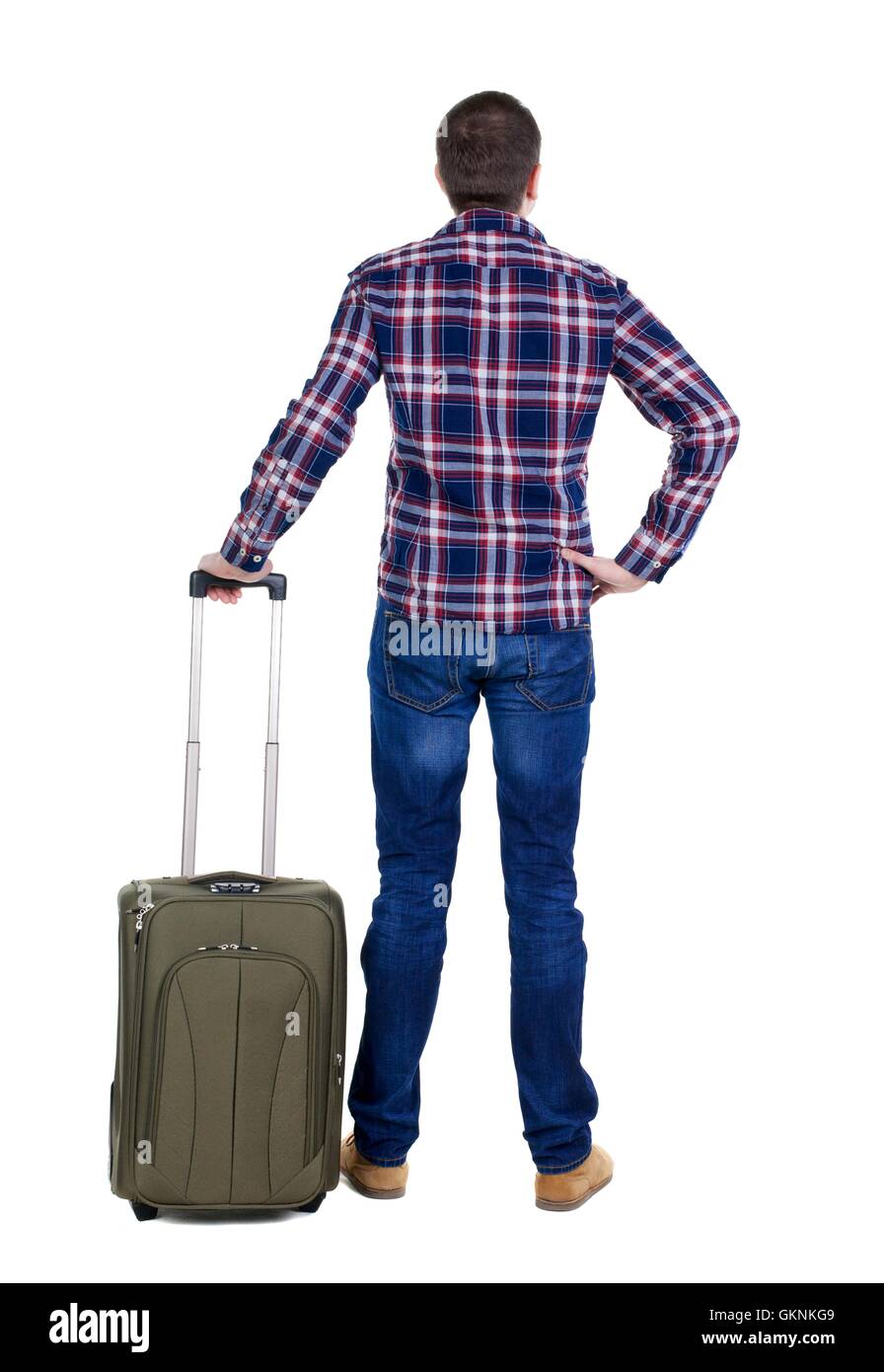Back view of man with green suitcase looking up Stock Photo - Alamy