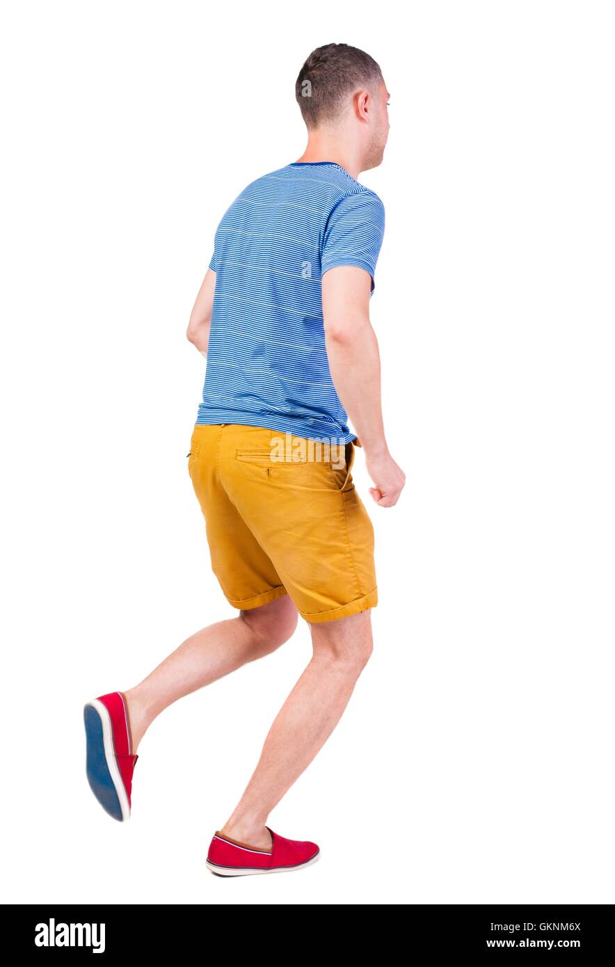 Back view of running man in t-shirt and shorts Stock Photo - Alamy