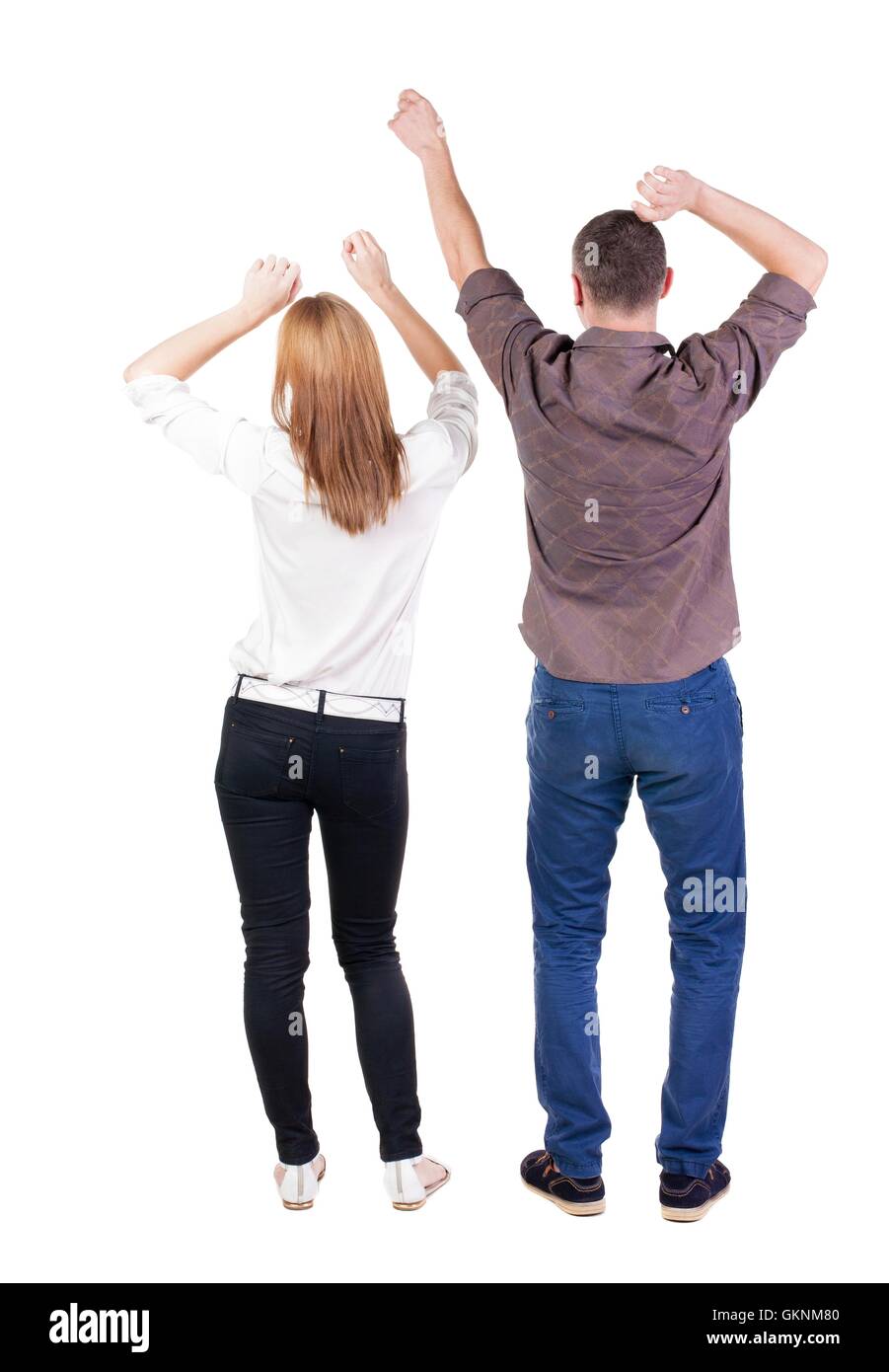 Back view of joyful couple celebrating victory hands up Stock Photo - Alamy