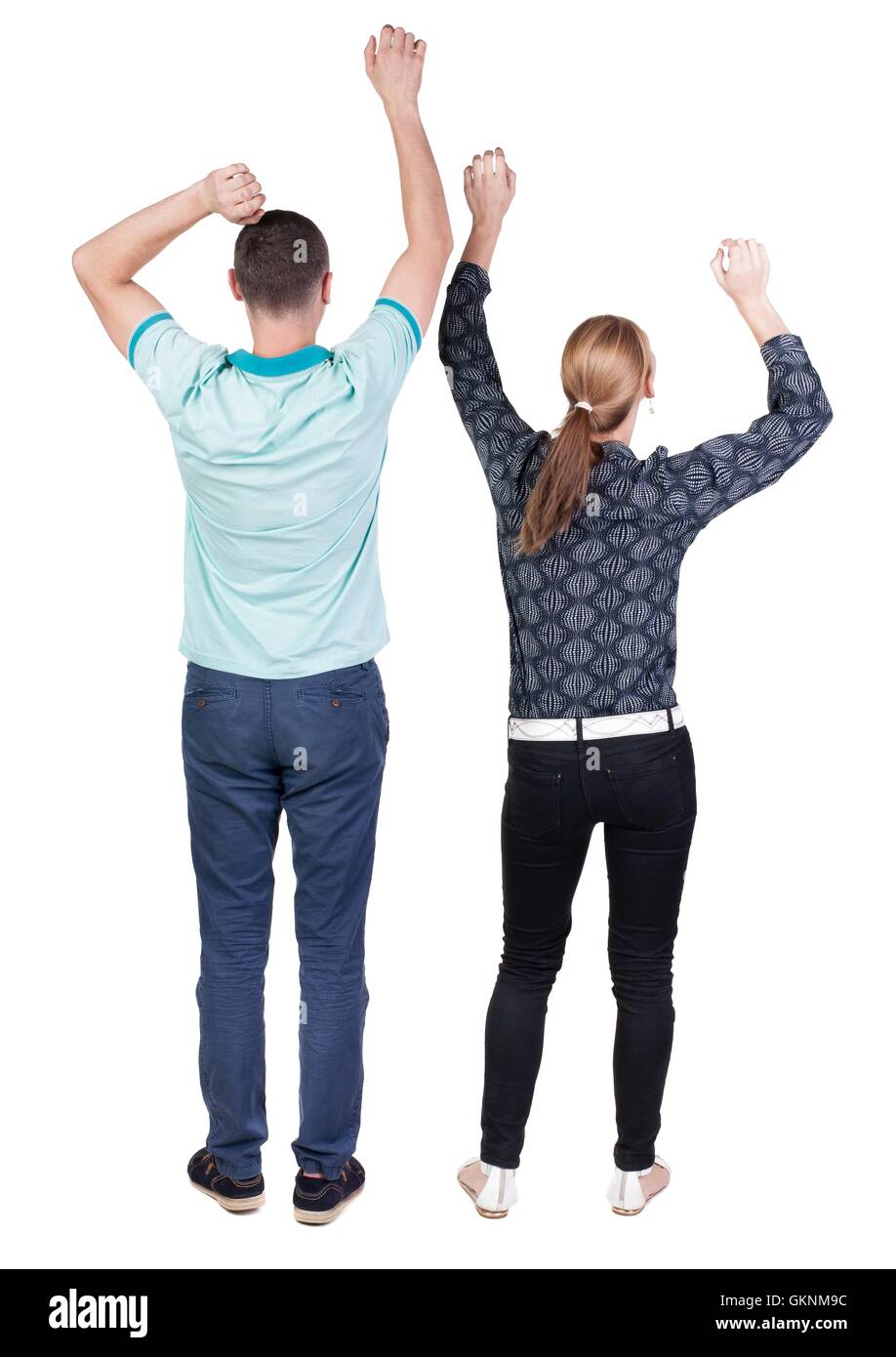 Back view of joyful couple celebrating victory hands up Stock Photo - Alamy