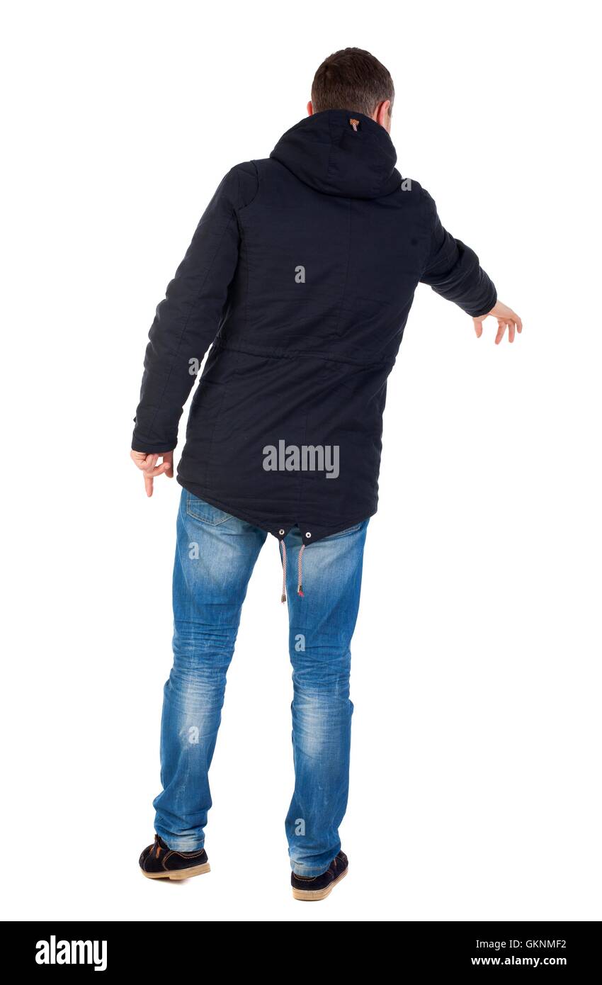 Back view of pointing young men in parka Stock Photo - Alamy