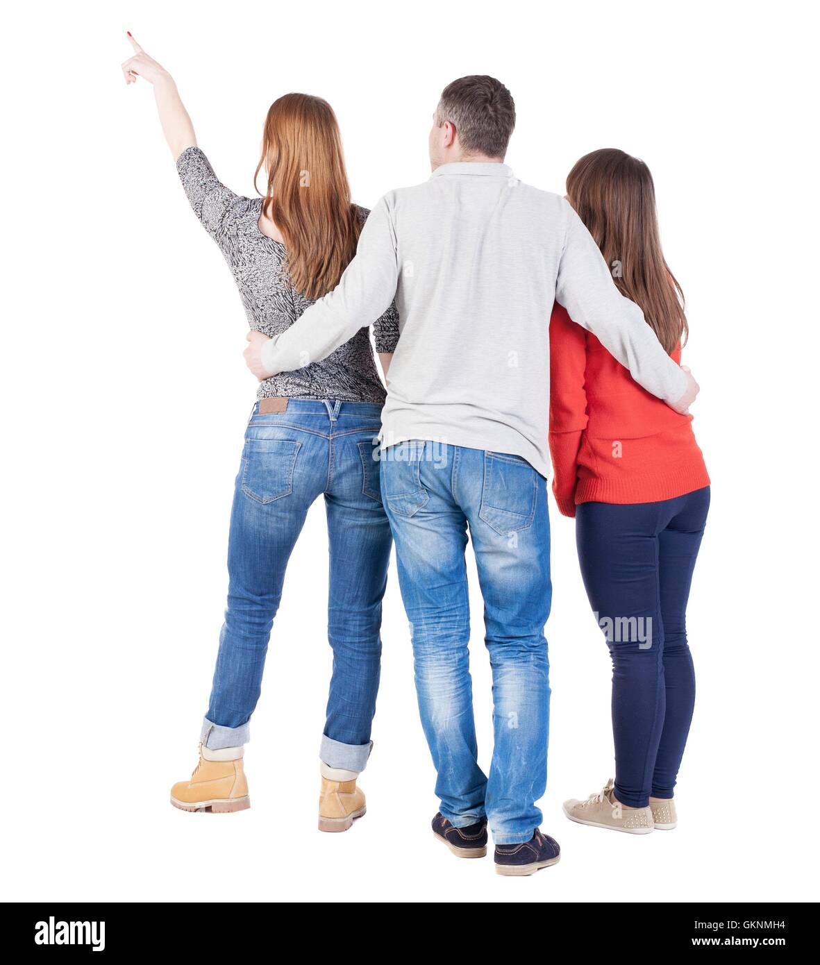 Back view of three friends pointing Stock Photo - Alamy