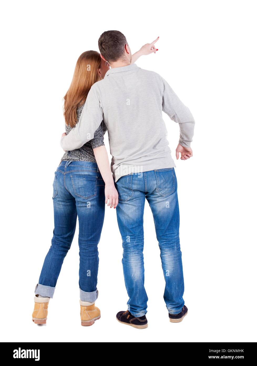young couple pointing at wal Back view (woman and man Stock Photo - Alamy