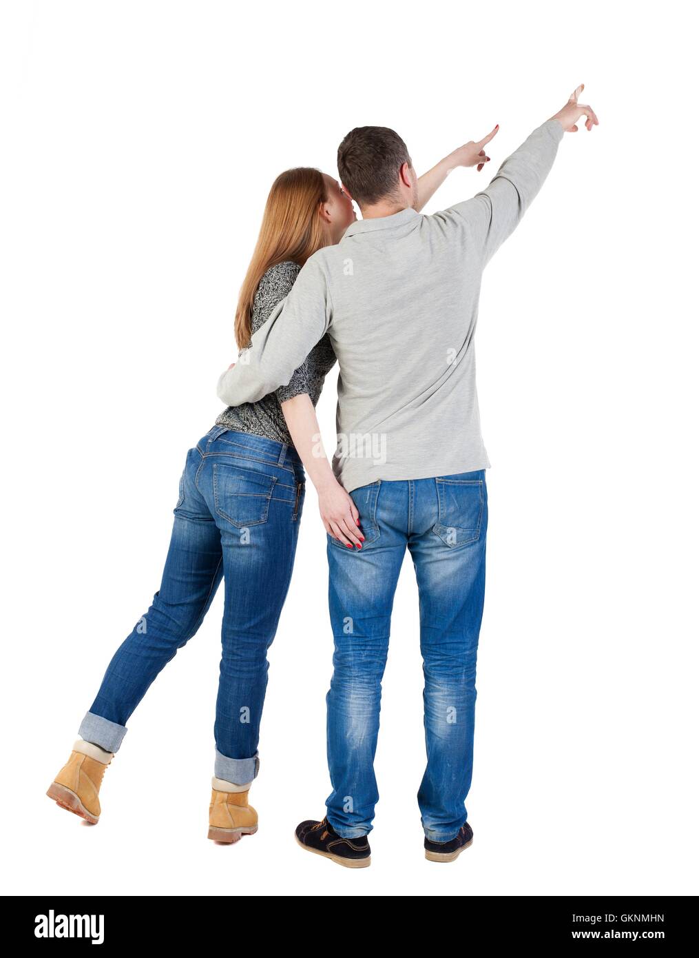young couple pointing at wal Back view (woman and man Stock Photo - Alamy