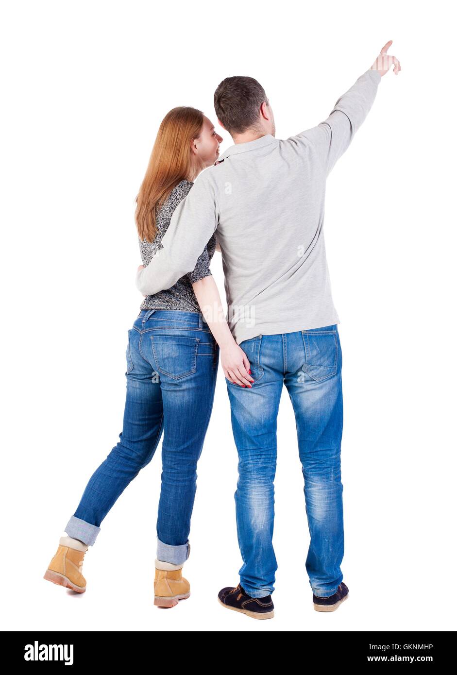 young couple pointing at wal Back view (woman and man Stock Photo - Alamy