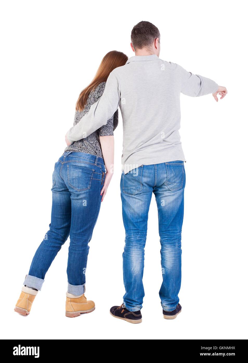 young couple pointing at wal Back view (woman and man Stock Photo - Alamy