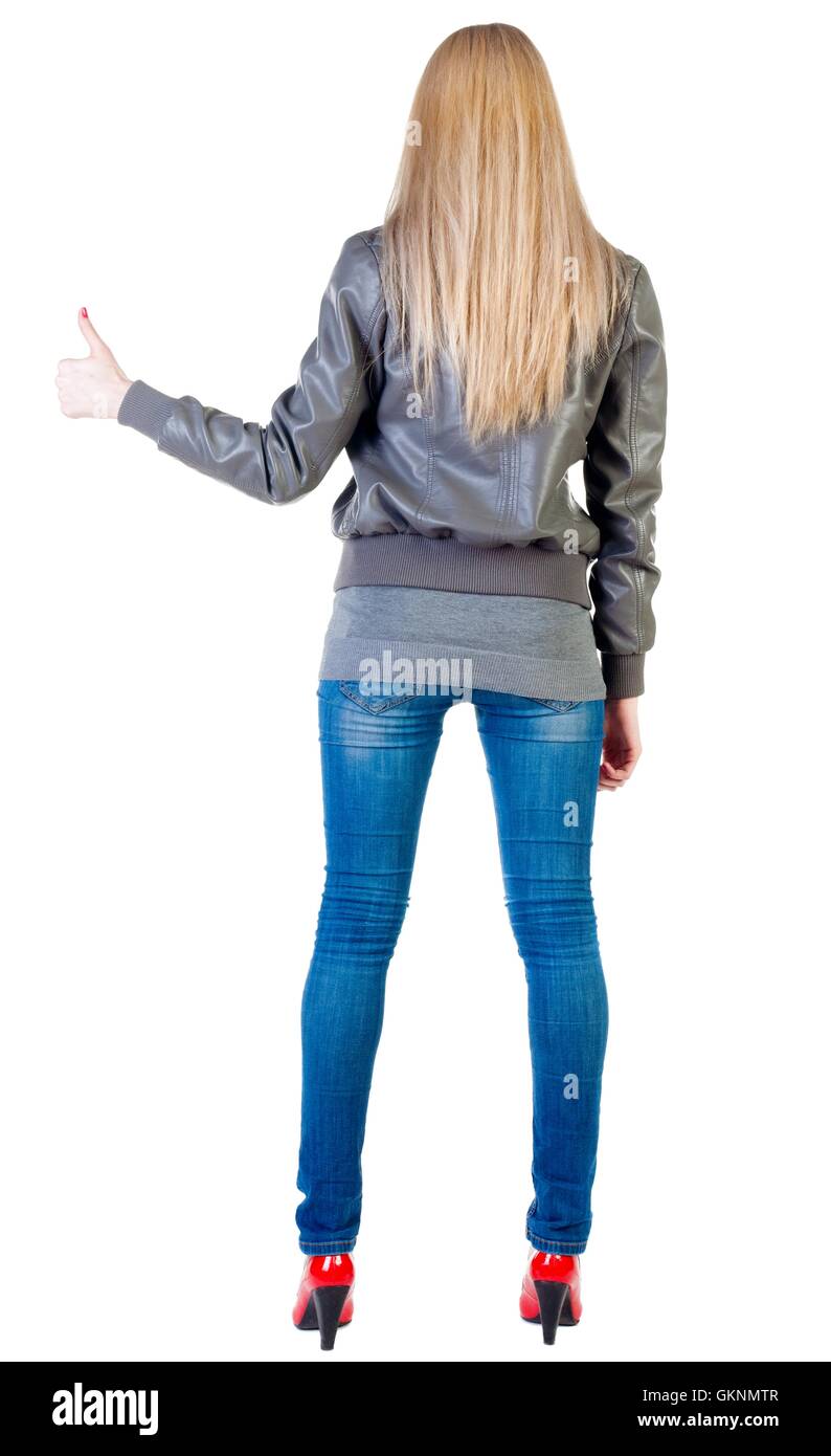 back view of standing young blonde woman showing thumb up Stock Photo ...
