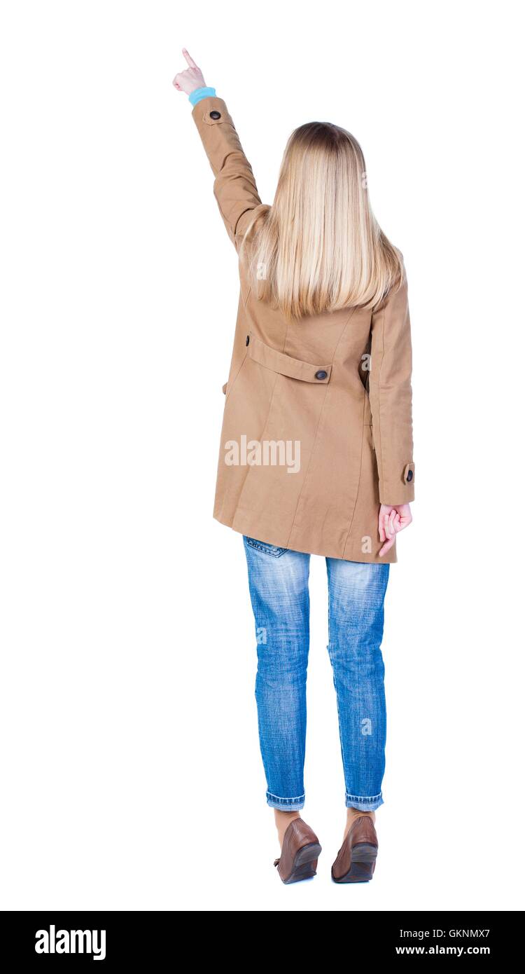 Back view of pointing womanin brown cloak Stock Photo - Alamy