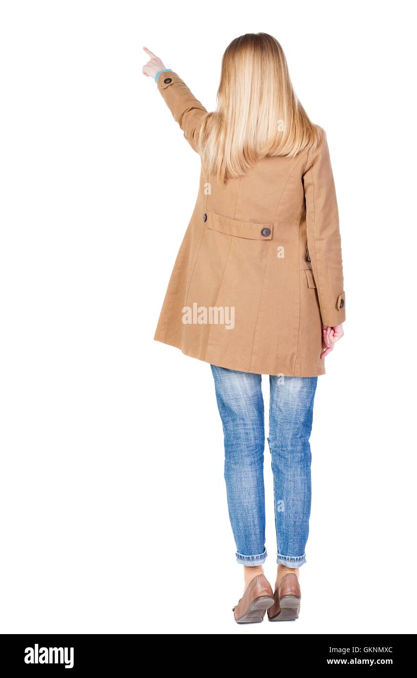 Back view of pointing womanin brown cloak Stock Photo - Alamy