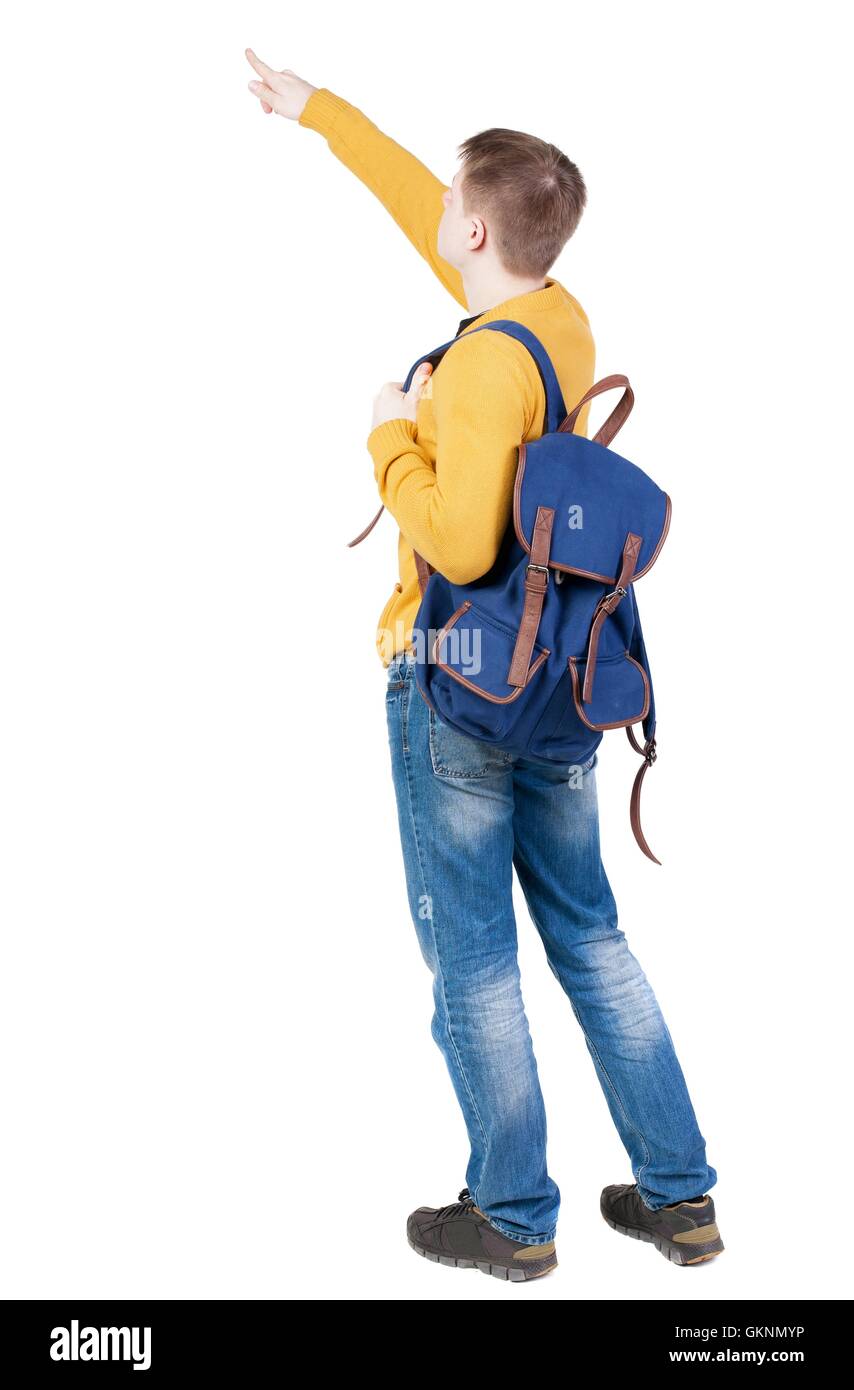 Back view of pointing young men with backpack Stock Photo - Alamy