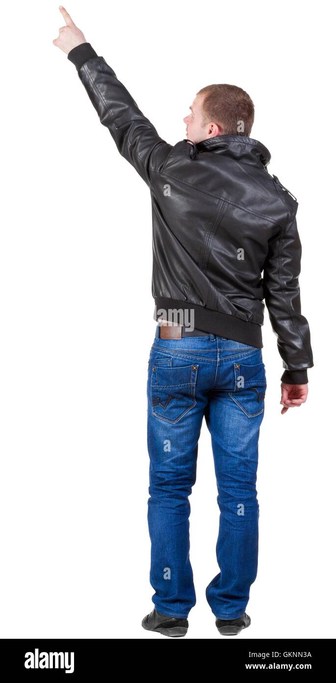Back view of pointing man in jeans and jacket Stock Photo - Alamy