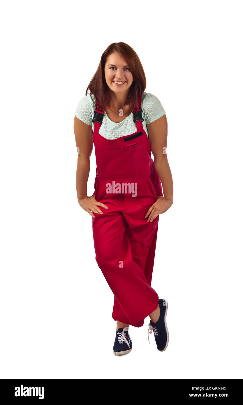 Young happy woman in red overalls , isolated on a white background ...