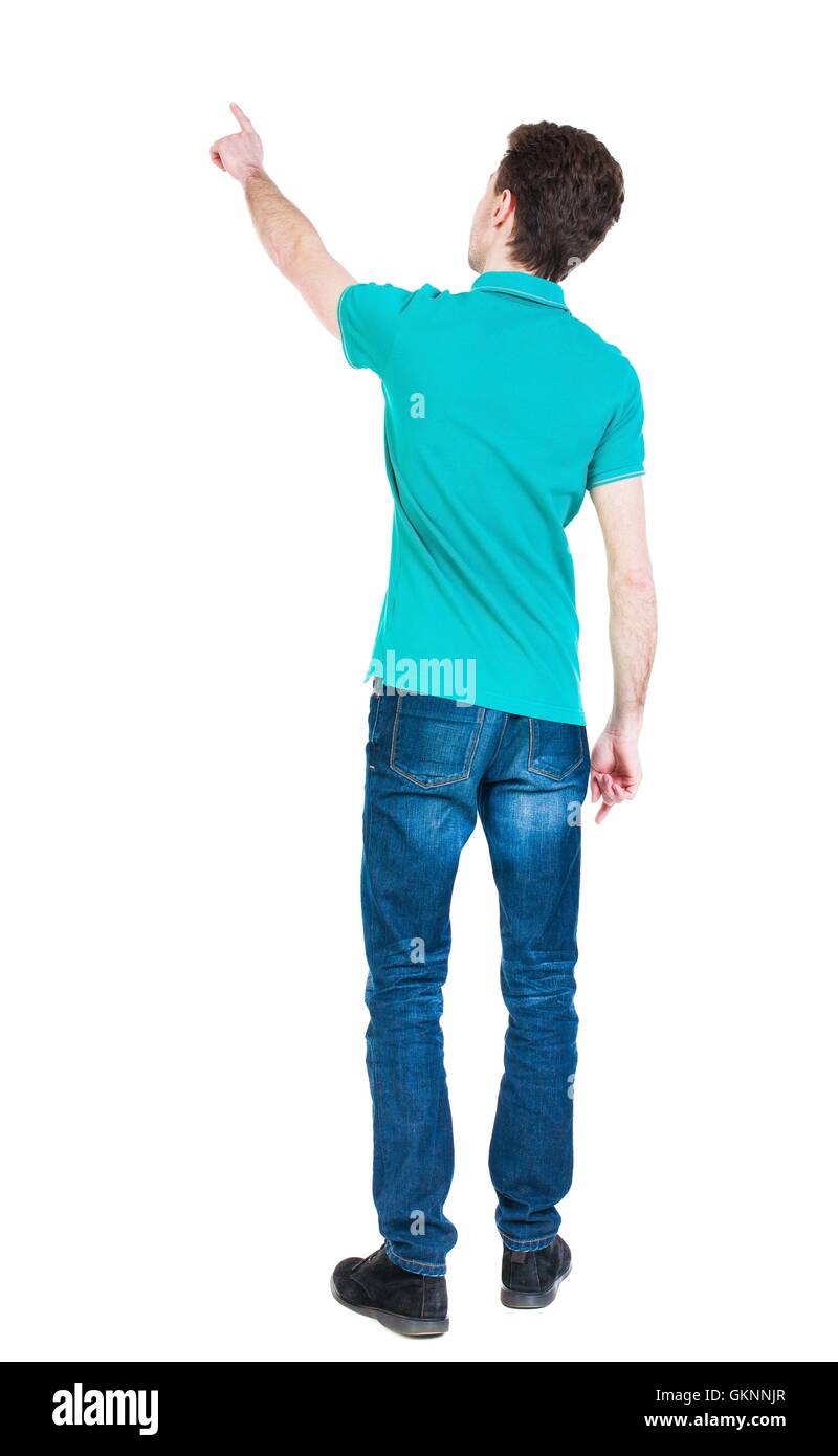 Back view of pointing young men in shirt and jeans. Young guy Stock ...