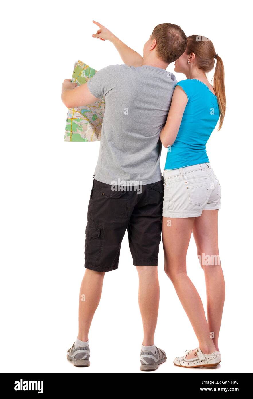 Back view journey of the young couple looking at the map Stock Photo ...