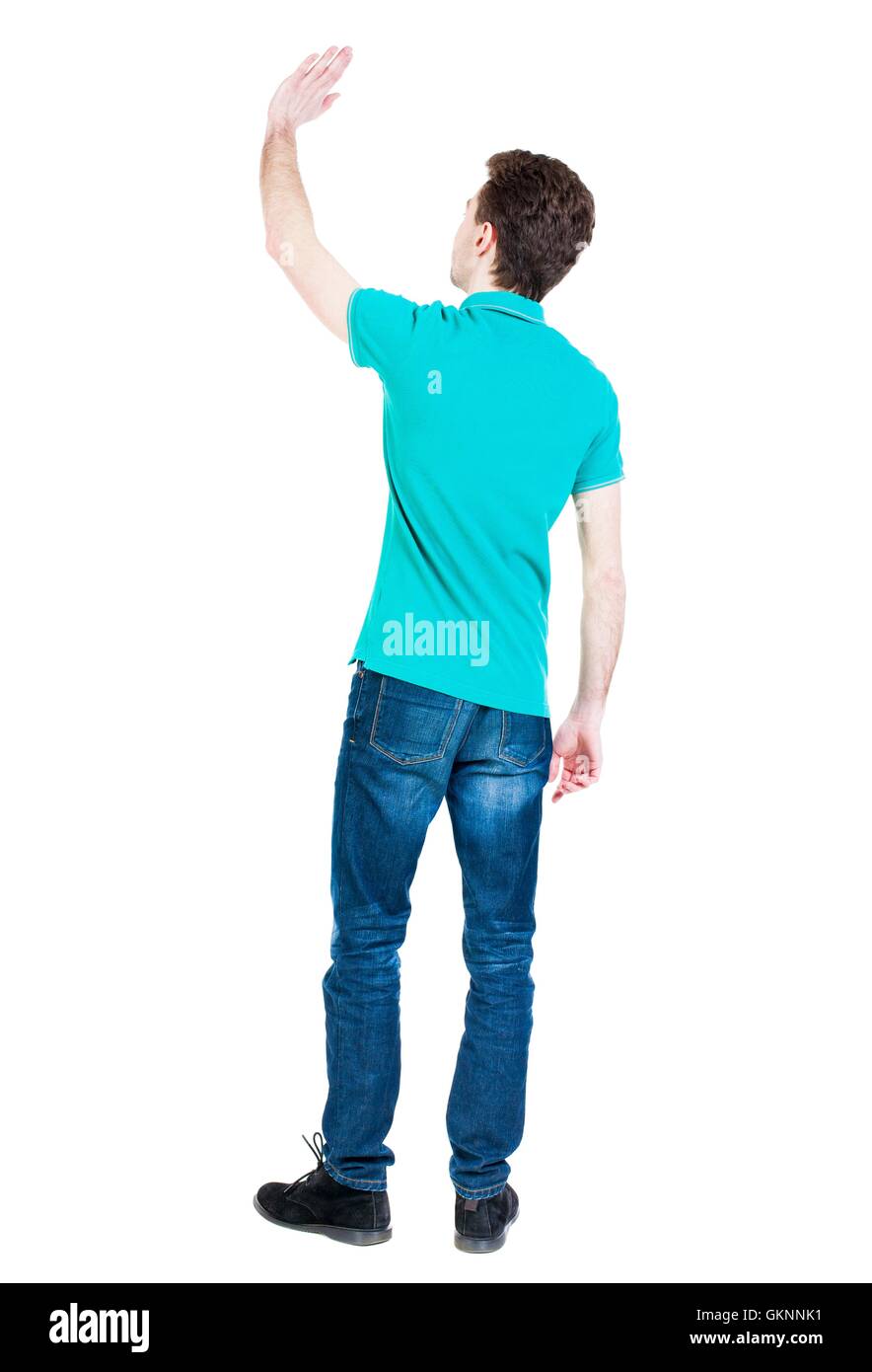 Back view of handsome man greeting waving from his hands Stock Photo ...