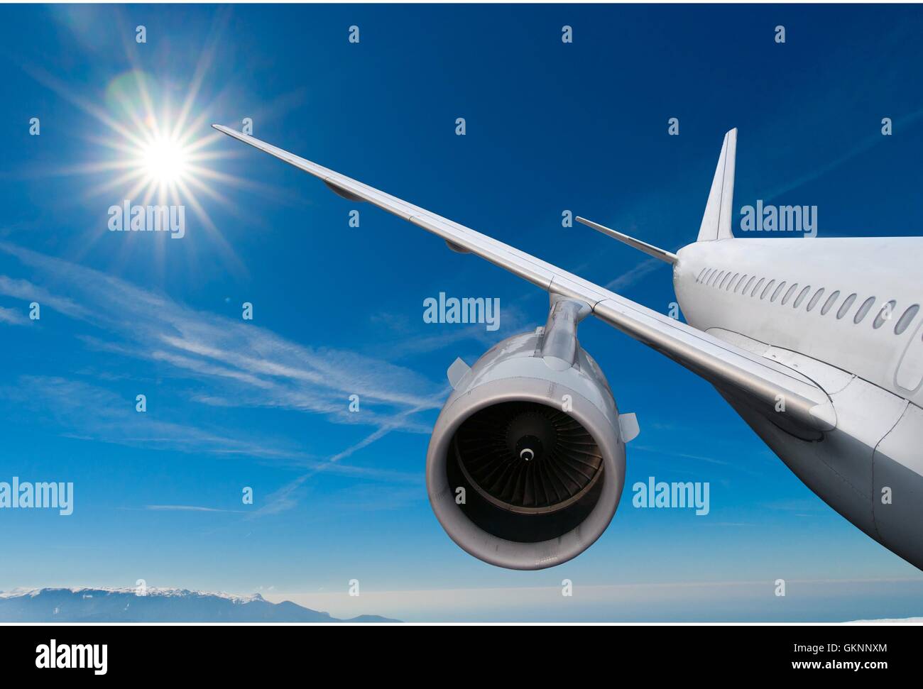 airplane flying down Stock Photo - Alamy