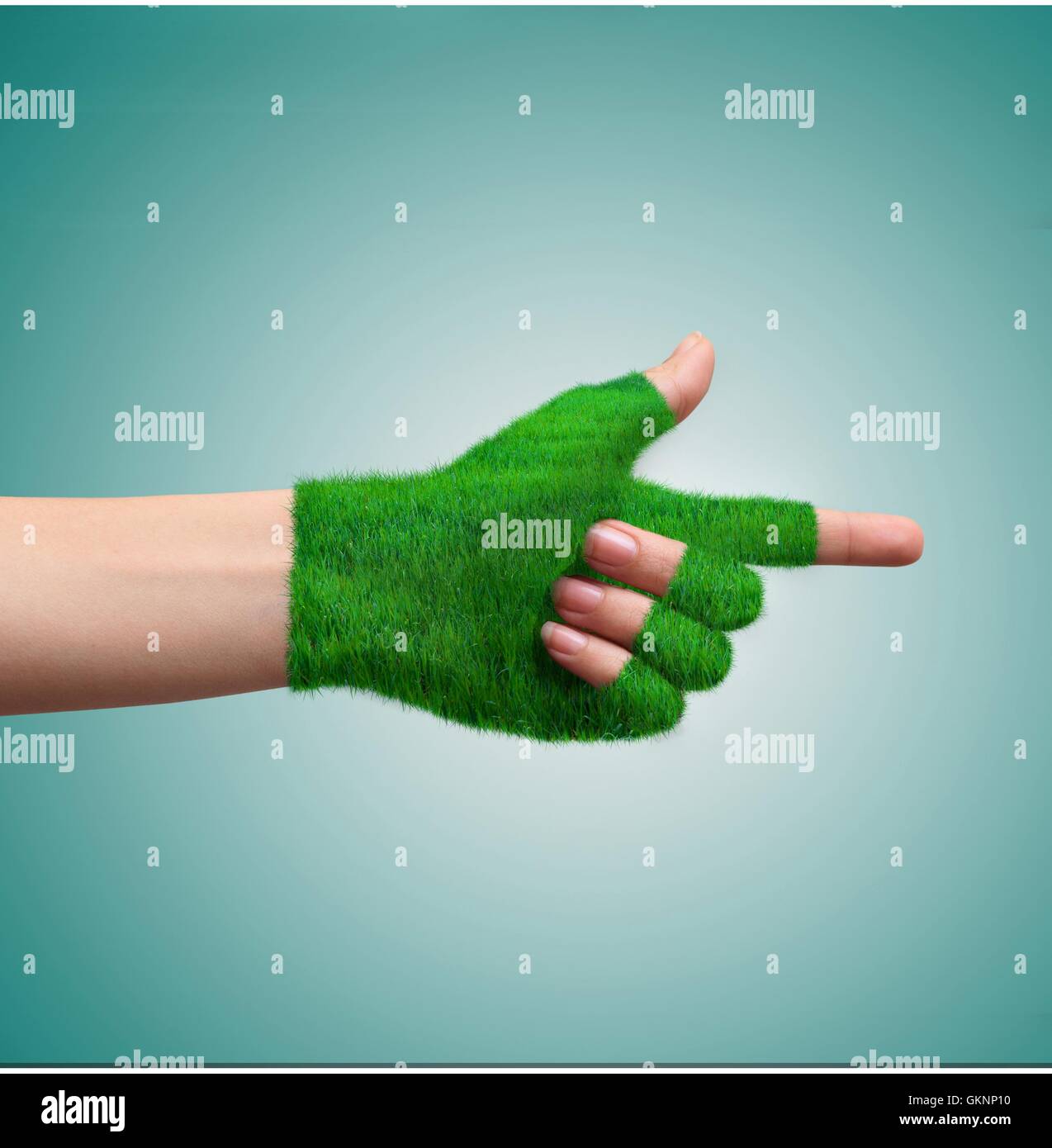 Go Green Concept Hand in glove grass indicates the direction Stock ...