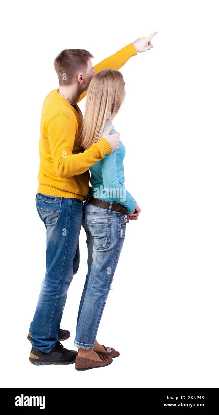 young couple pointing at wal Back view (woman and man Stock Photo - Alamy