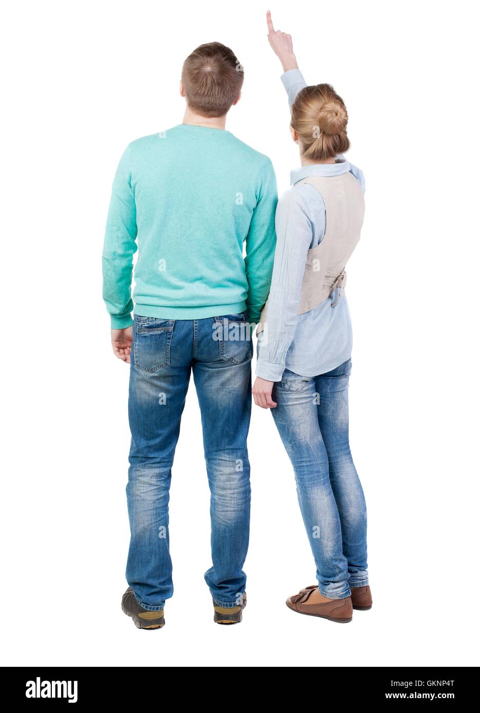 young couple pointing at wal Back view (woman and man Stock Photo - Alamy