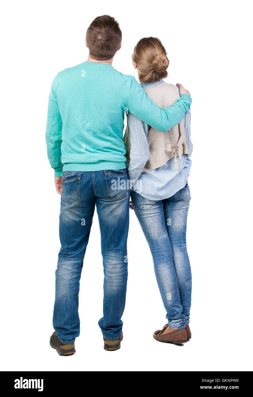 Back view of young embracing couple (man and woman) hug and look Stock ...