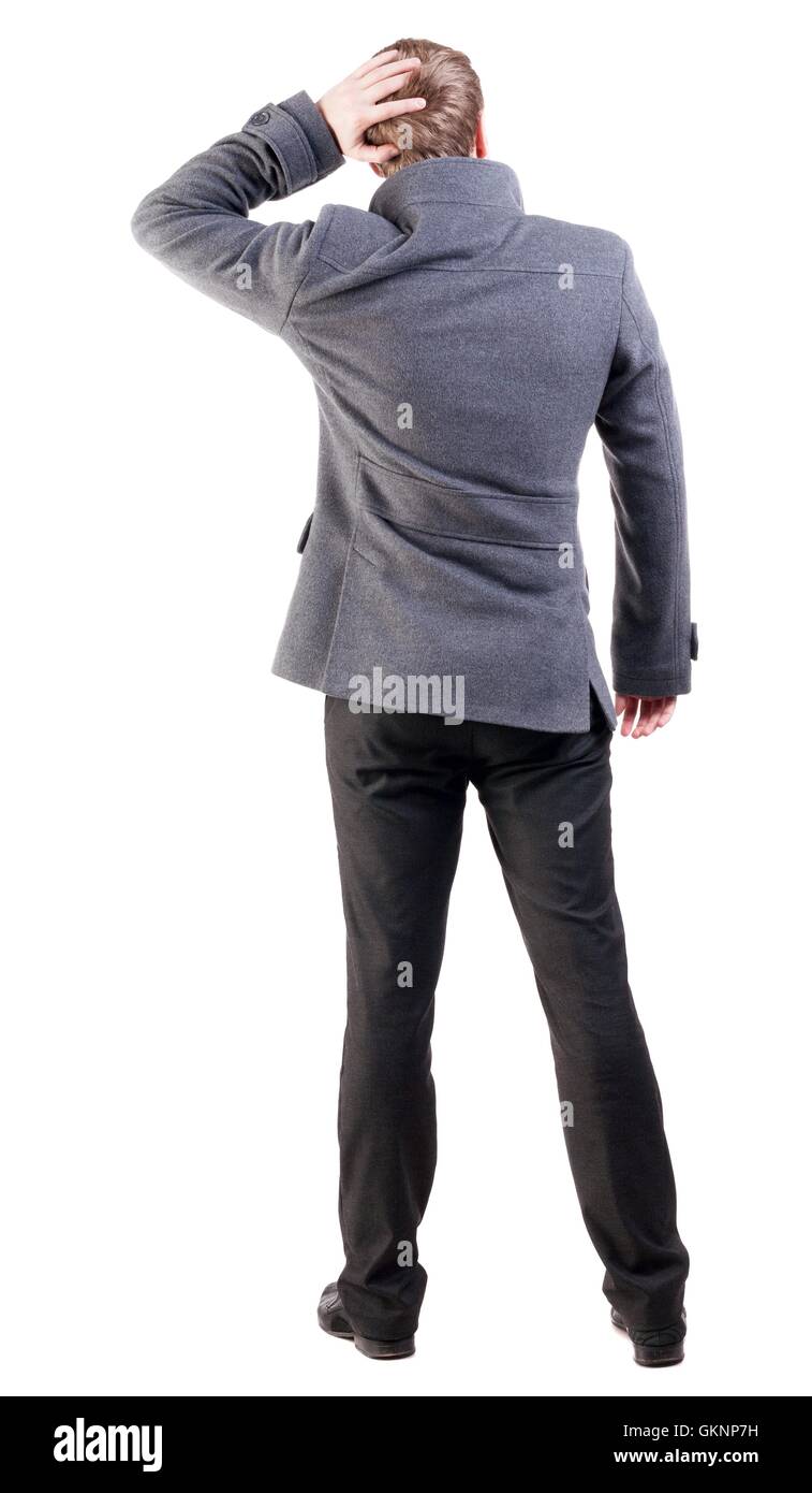 Back view of thinking business man in coat Stock Photo - Alamy