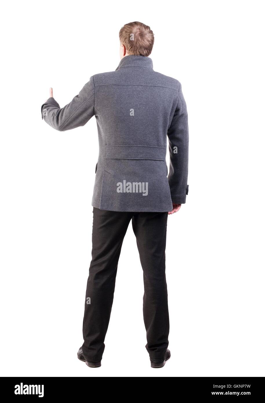 Back view of business man shows thumbs up Stock Photo - Alamy