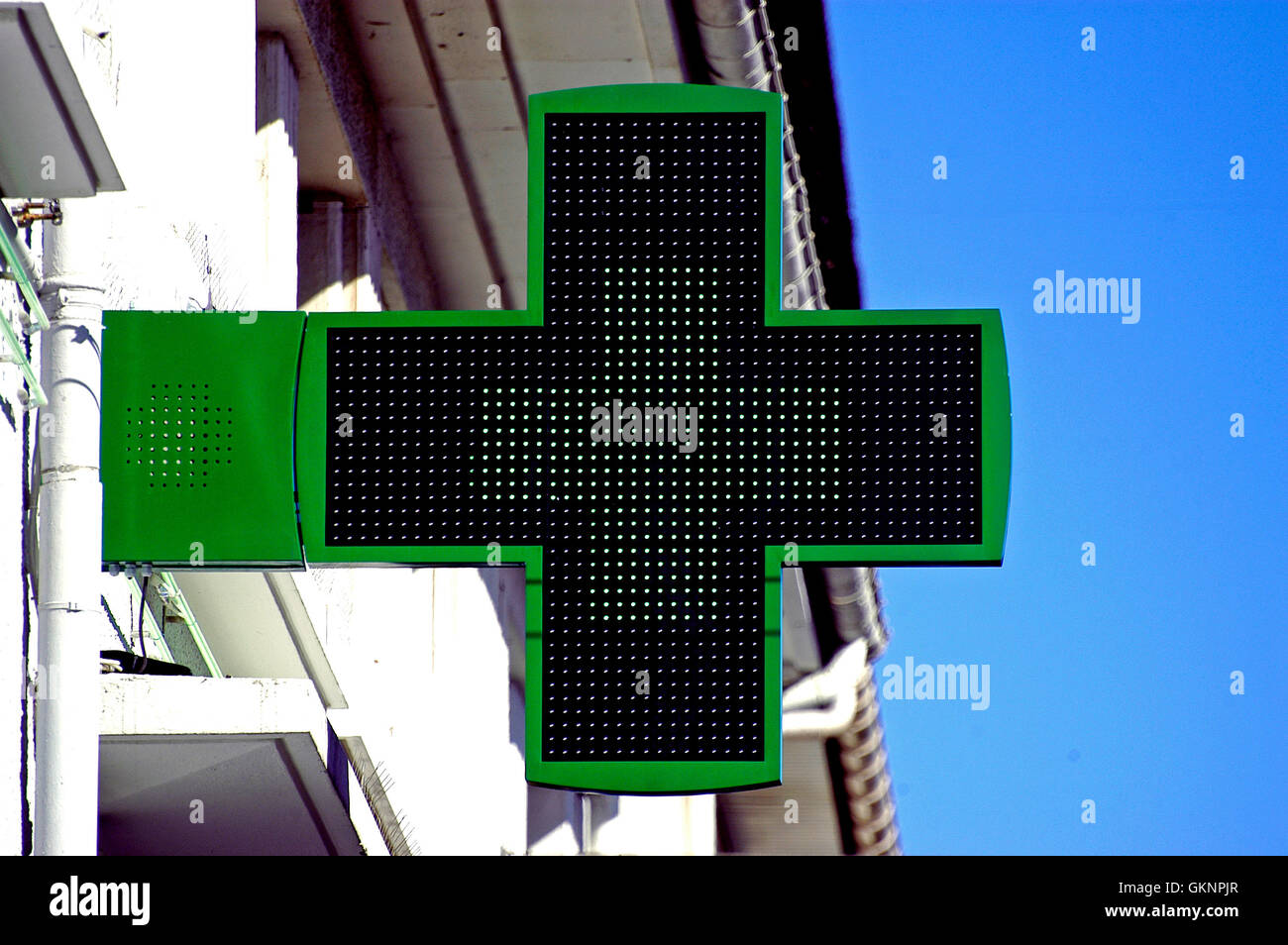 The green cross on the facade of a building to signal the presence of a ...