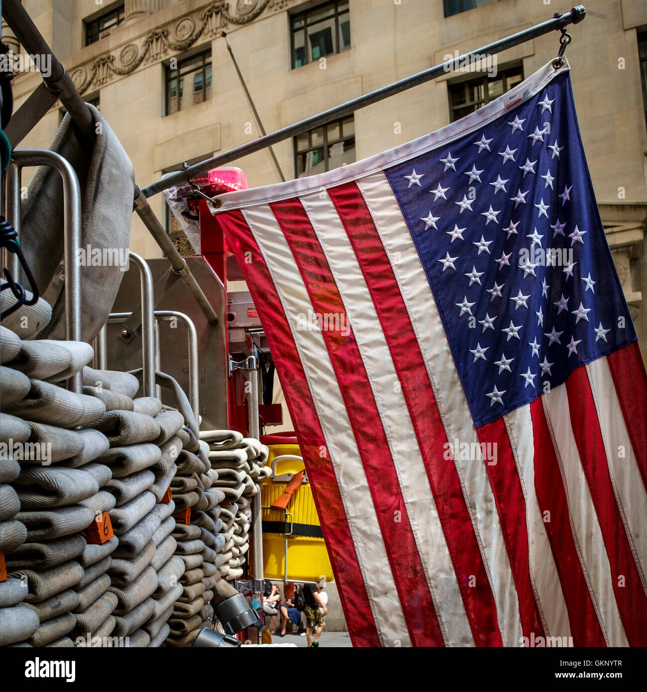 An American Flag hanging from the rear of a New York Fire Engine Stock ...