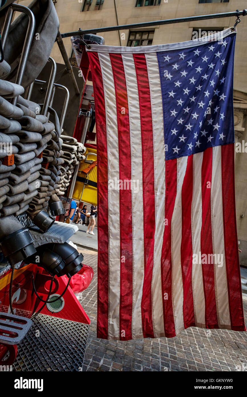 An American Flag hanging from the rear of a New York Fire Engine Stock ...