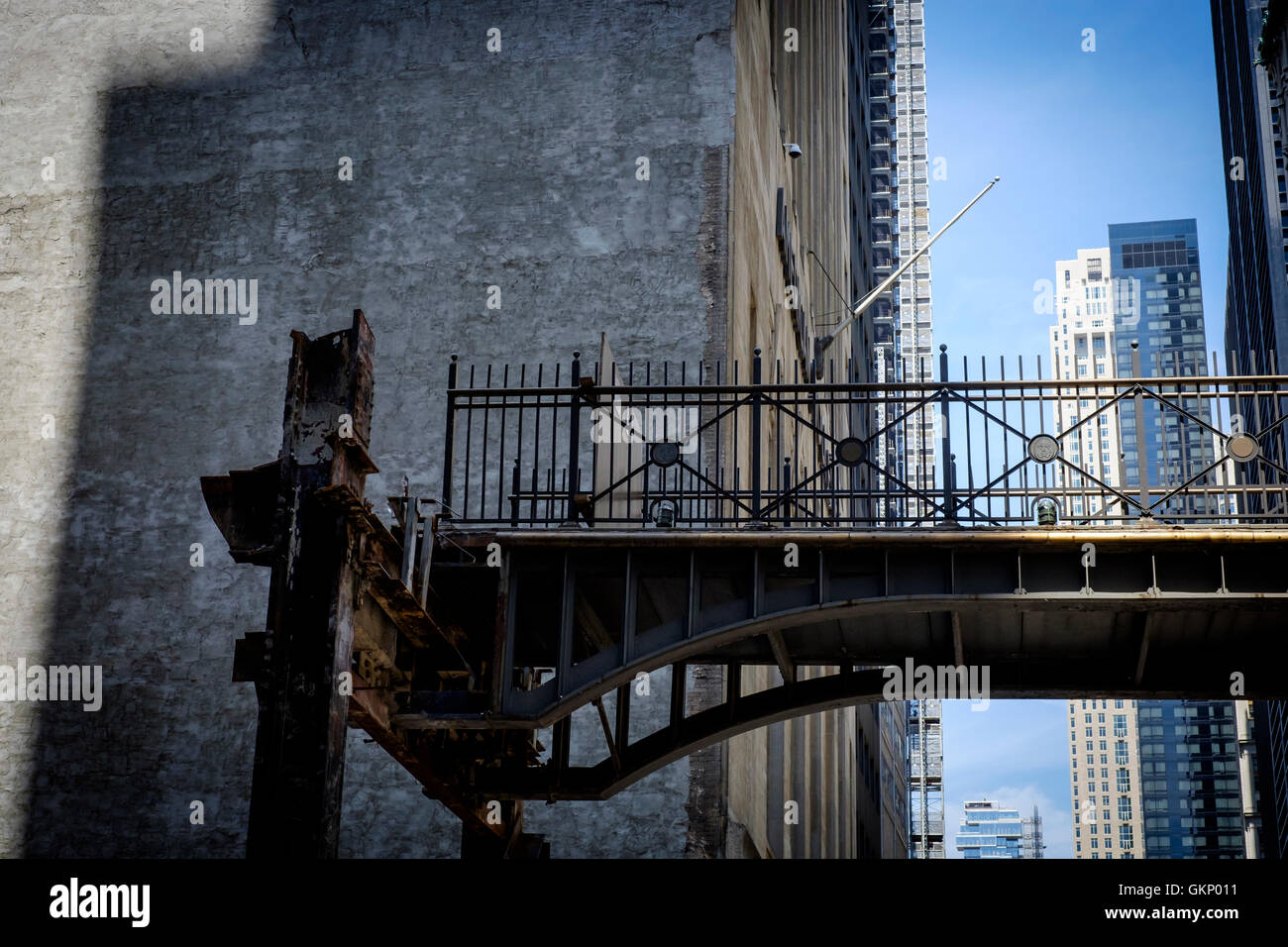 A cast iron footbridge that ends in mid-air due to building works. A ...
