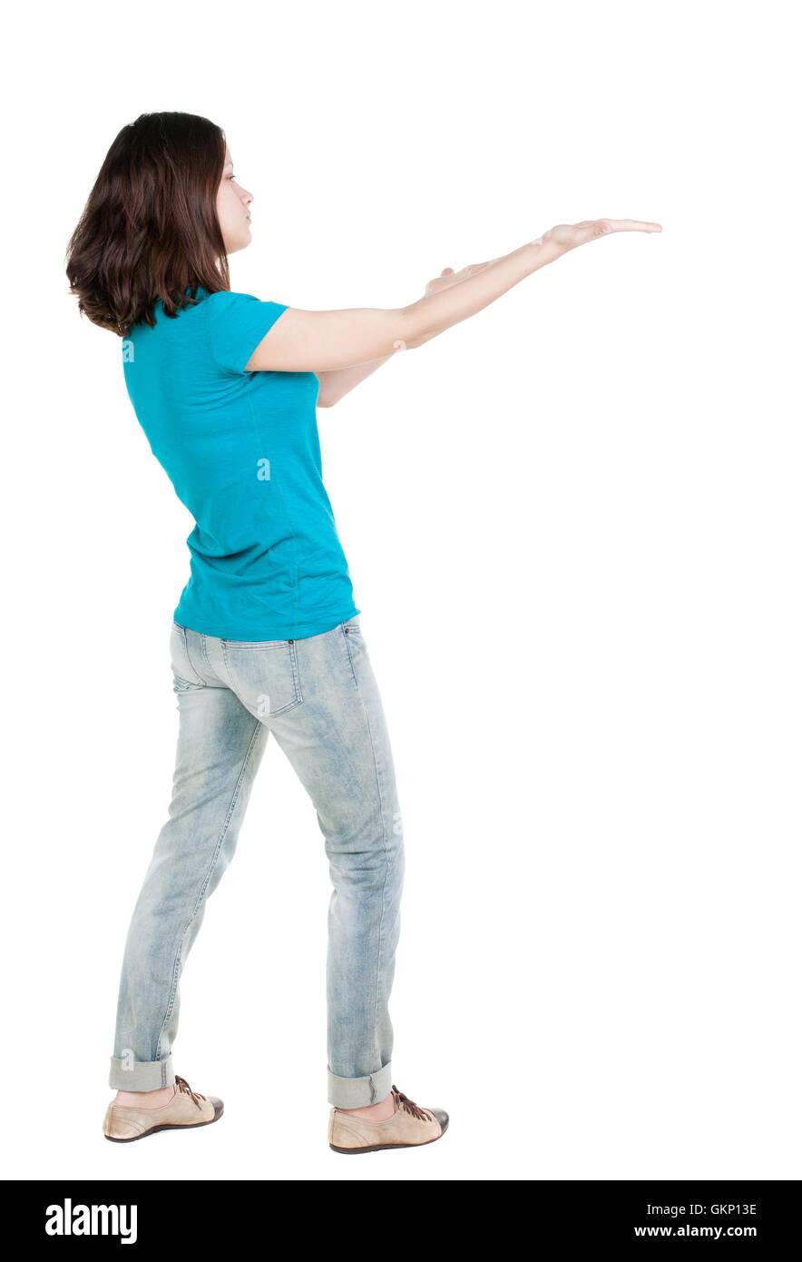 Back view of pointing woman Stock Photo - Alamy