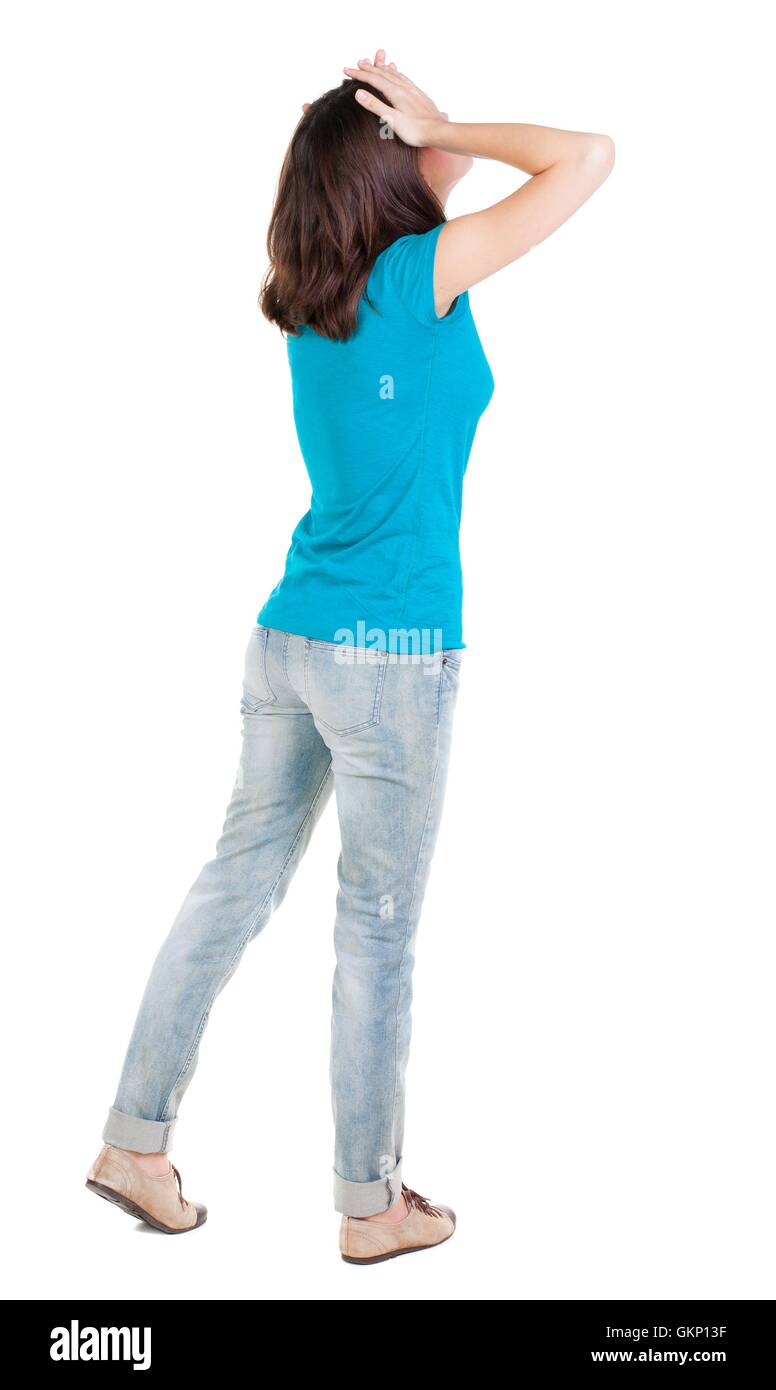 Back view of shocked woman in blue jeans Stock Photo - Alamy